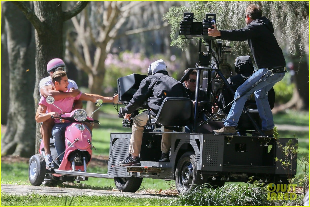 Zac Efron & Dwayne Johnson Take a Ride on a Hot Pink Scooter on ...