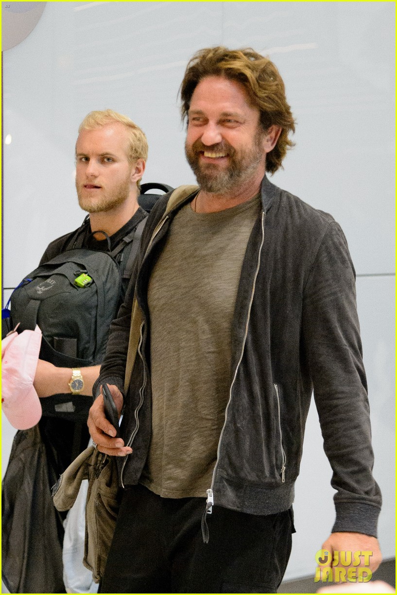 Gerard Butler Limps Off Plane in London Following Motorcycle Accident ...