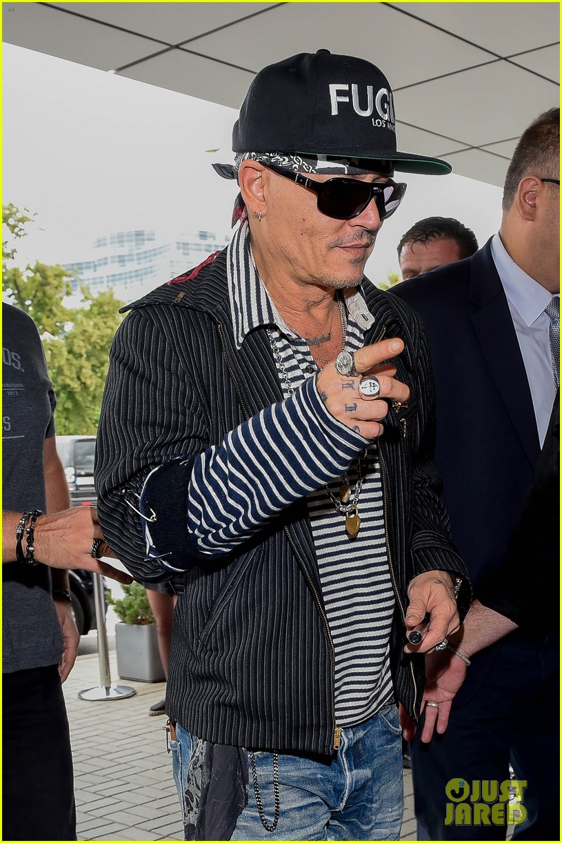 Johnny Depp Greets Fans While Arriving at Poland Airport: Photo 4101150 ...