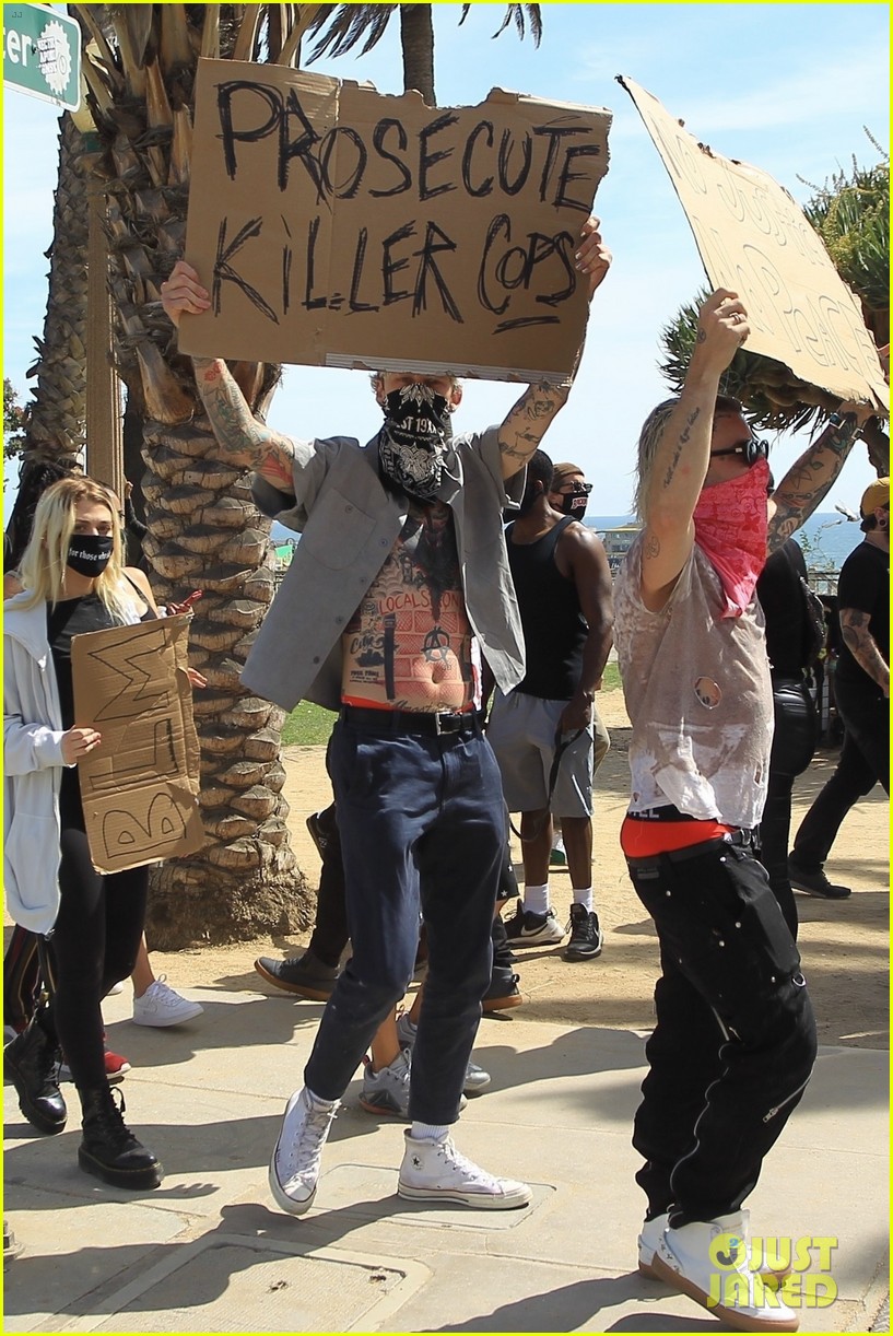 Machine Gun Kelly Holds 'Prosecute Killer Cops' Sign During Protest in ...