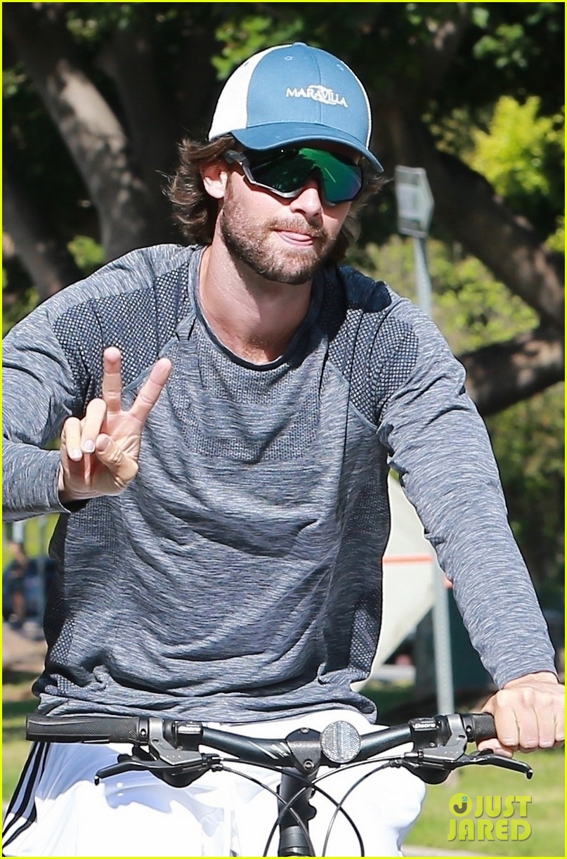 Patrick Schwarzenegger Throws Up the Peace Sign on Bike Ride: Photo ...