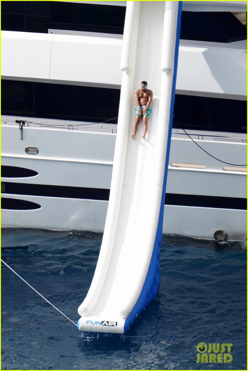 Shirtless John Legend Slides Down a Yacht During Family Vacation with ...