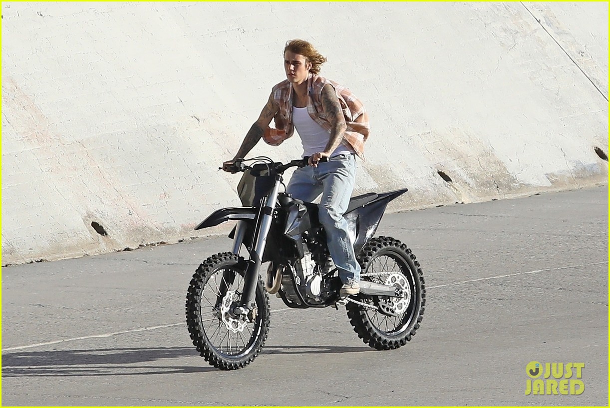 Justin Bieber Rides a Motorcycle While Seemingly Filming a New Music ...