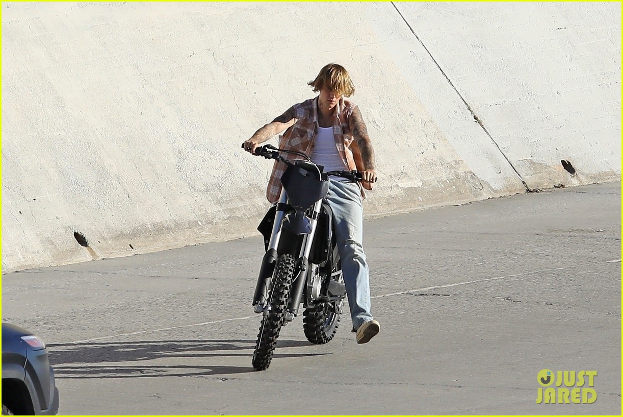 Justin Bieber Rides a Motorcycle While Seemingly Filming a New Music ...