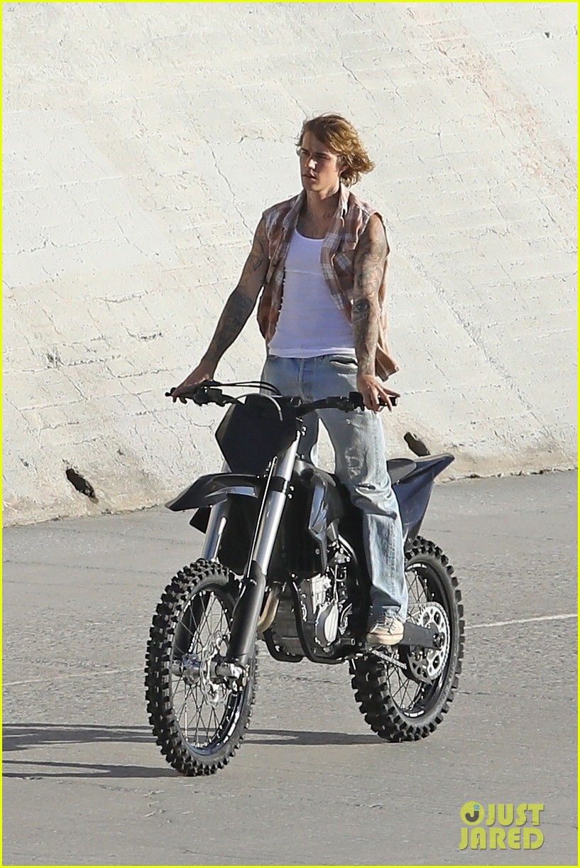 Justin Bieber Rides a Motorcycle While Seemingly Filming a New Music ...