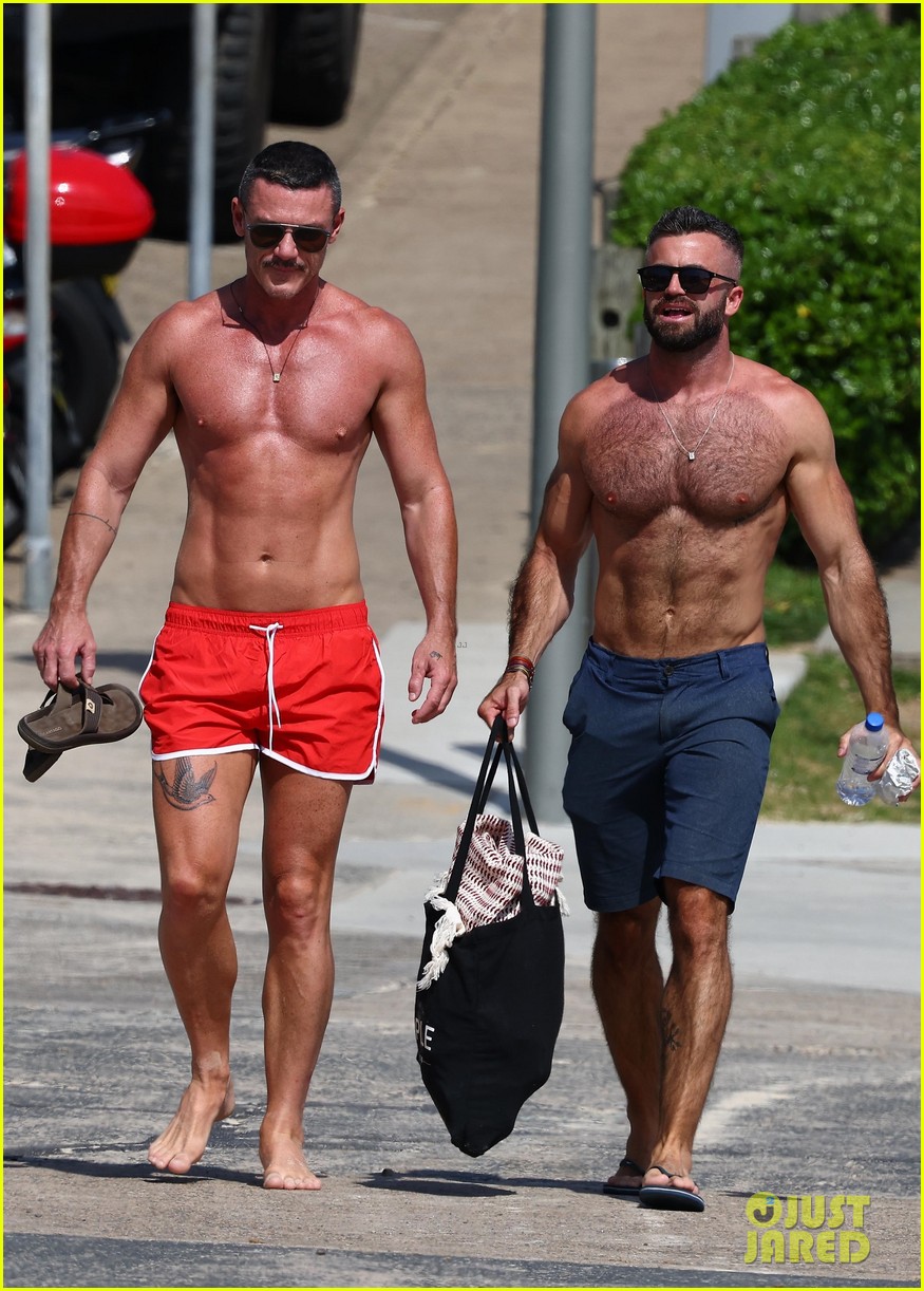 Luke Evans Shows Off New Leg Tattoo in Tiny Bathing Suit During Trip to ...
