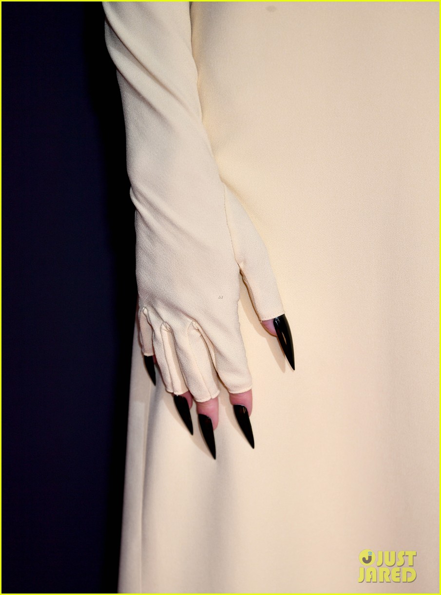 Emma Corrin Pairs Long, Black Nails with Yellow Dress for Emmy Awards ...