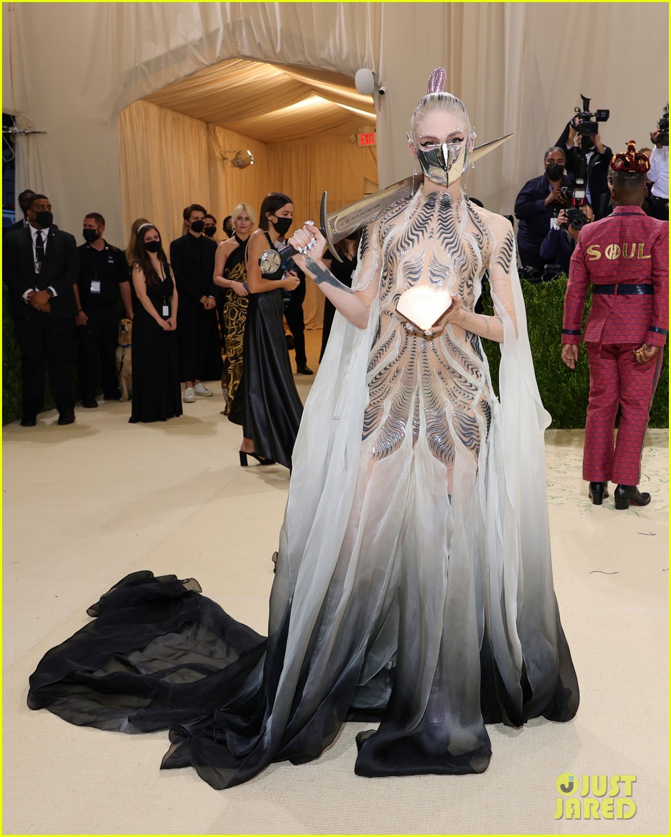 Grimes Carries A Sword & Wears Metal Mask To Met Gala 2021: Photo ...