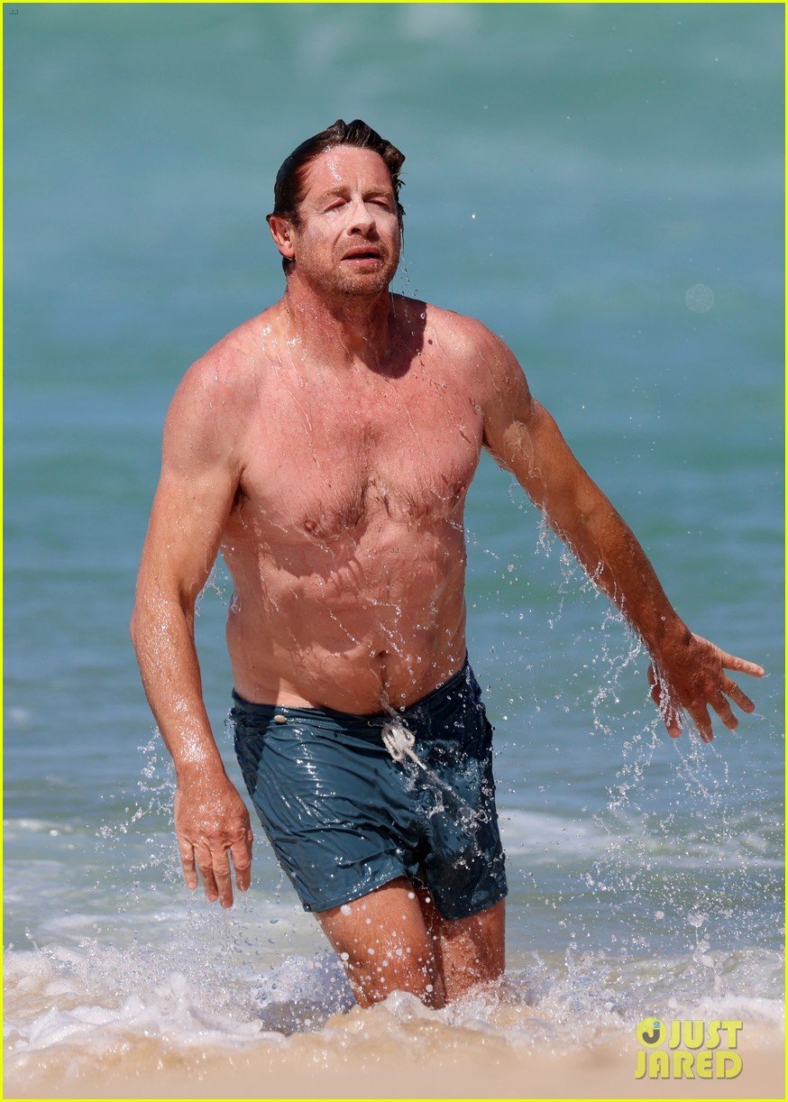 Simon Baker Hits the Beach for Shirtless Beach Day with Son Claude ...