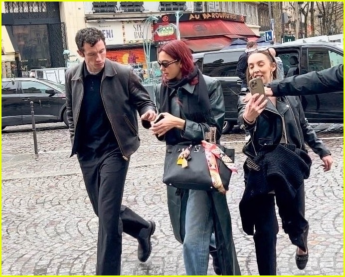 Dua Lipa & Callum Turner Hold Hands While Catching a Train from Paris ...