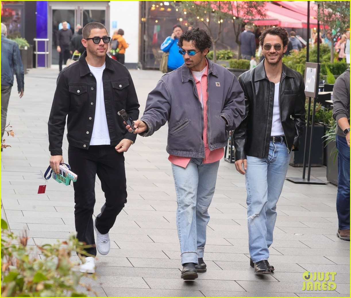 Nick Jonas Carries a Toy Musical Instrument During Outing With Brothers ...