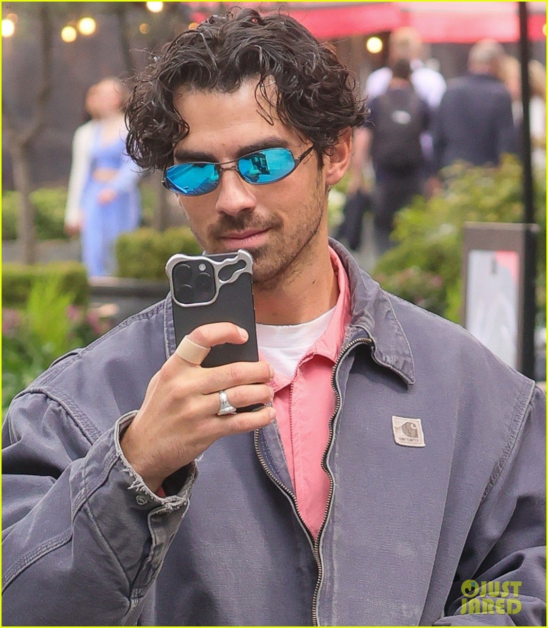 Nick Jonas Carries a Toy Musical Instrument During Outing With Brothers ...