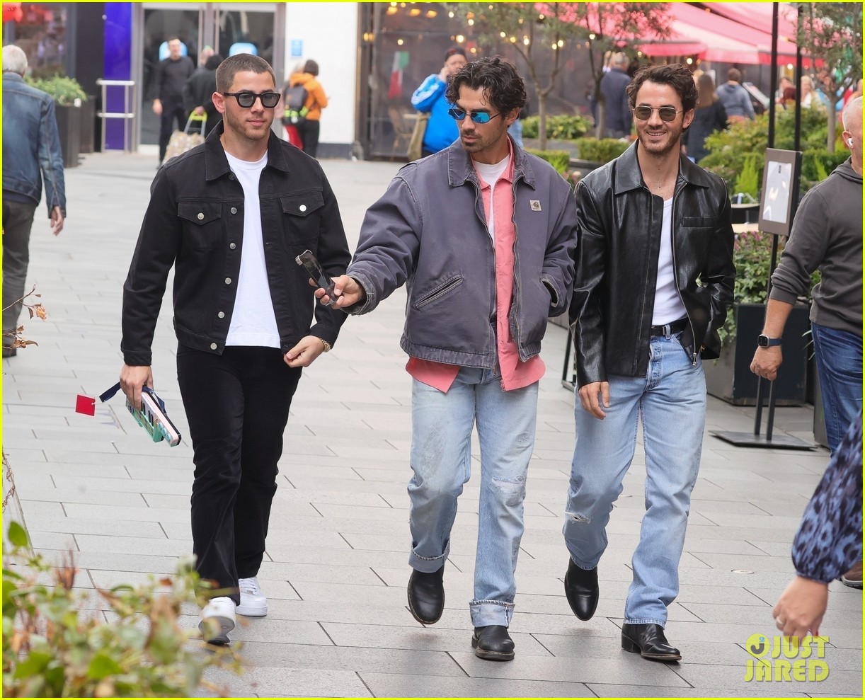 Nick Jonas Carries a Toy Musical Instrument During Outing With Brothers ...