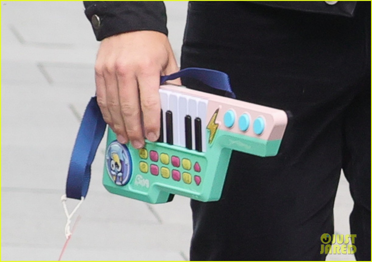 Nick Jonas Carries a Toy Musical Instrument During Outing With Brothers ...