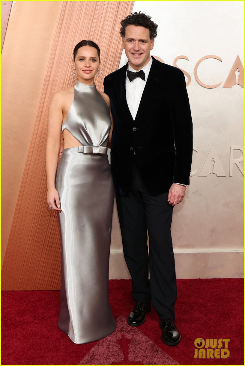Felicity Jones Wears Liquid Silver Dress to Oscars 2025, Gets Support ...