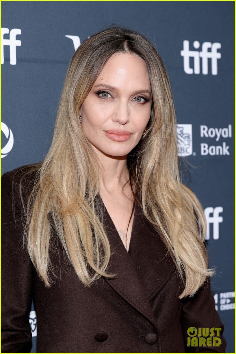 Angelina Jolie Bares Leg in Trenchcoat Dress at TIFF Premiere of New ...