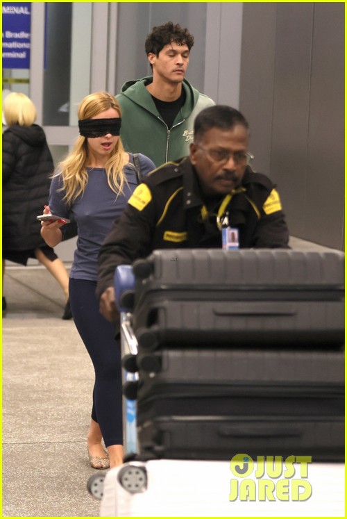 Addison Rae Wears Blindfold at LAX Airport With Basketball Player ...