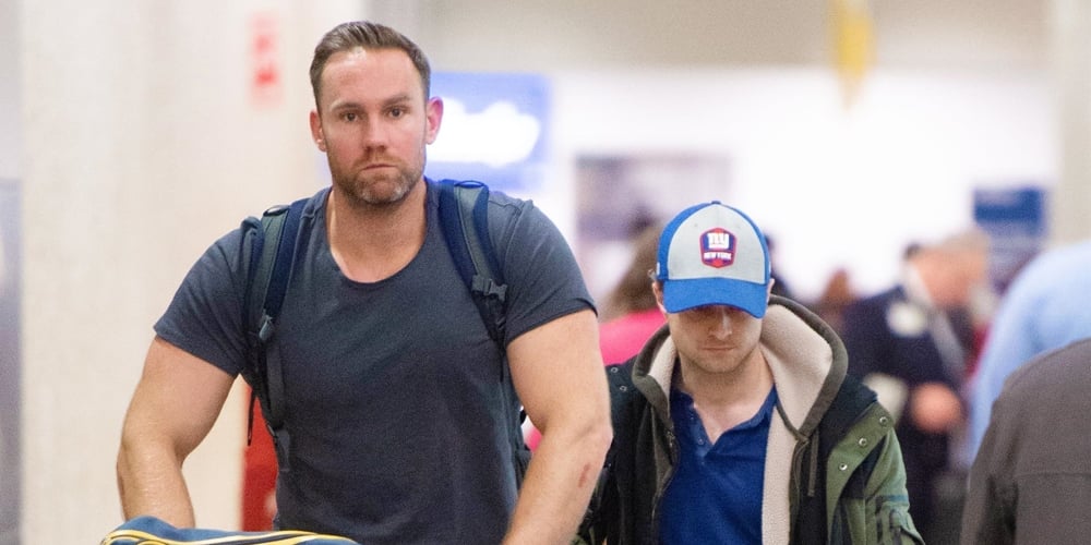 Daniel Radcliffe Arrives at JFK Airport With A Super Hot Bodyguard ...