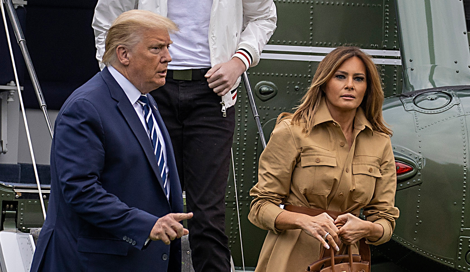 Melania Trump Appears to Pull Hand Away from President Trump Yet Again ...